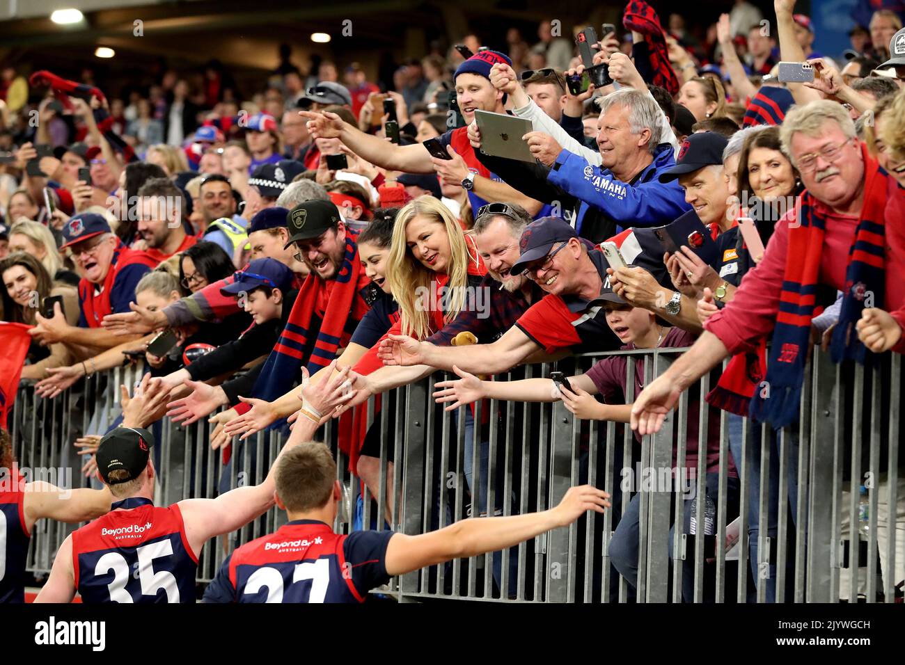 Demons fans congratulate players after winning the AFL Grand Final ...