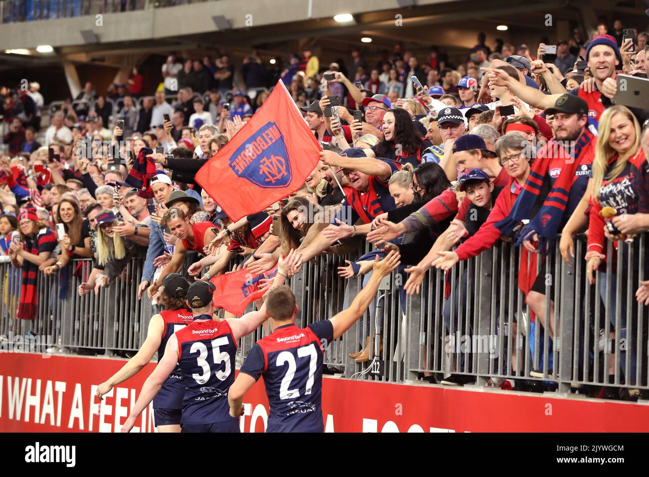 Demons fans congratulate players after winning the AFL Grand Final ...