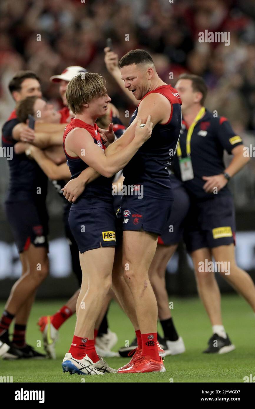 Charlie Spargo and Steven May of the Demons celebrate after winning the ...