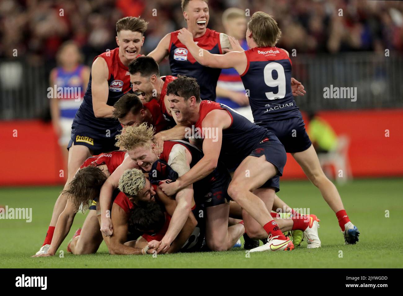 Demons players celebrate after winning the AFL Grand Final match ...