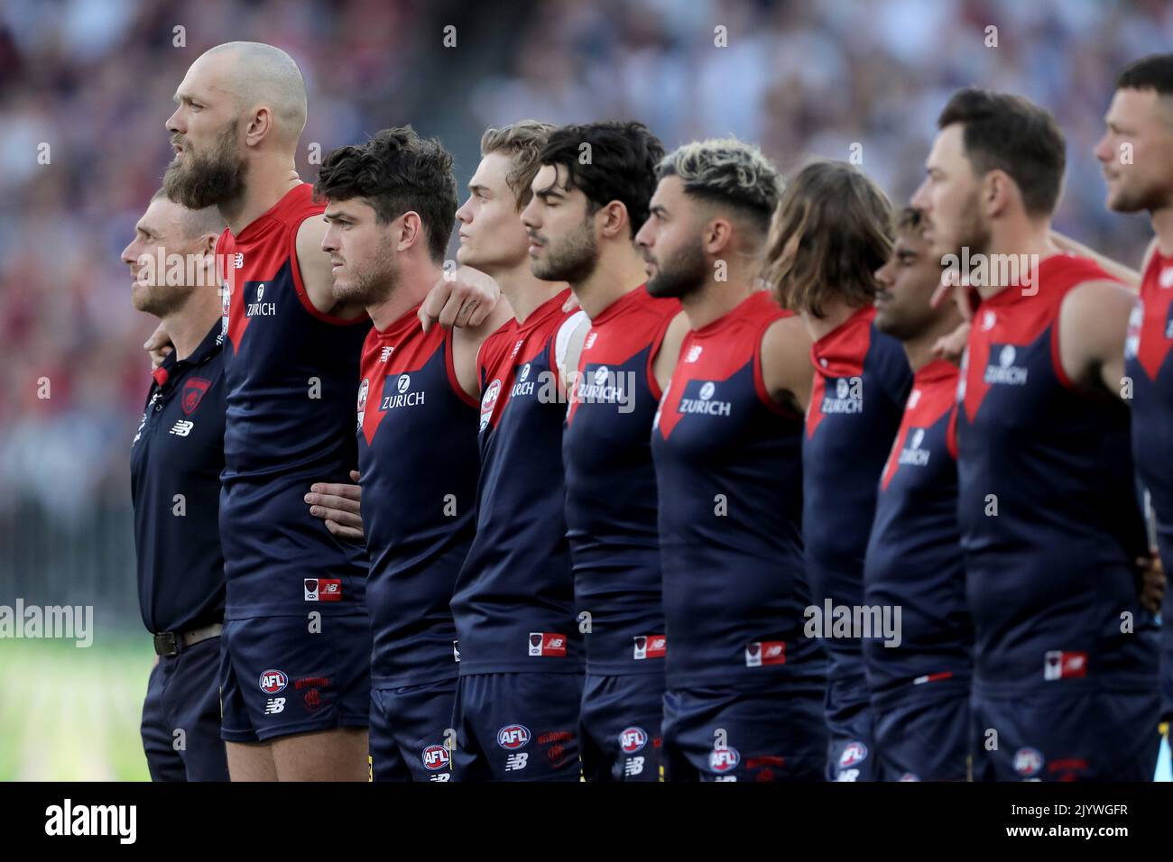 Demons players stand for the National Anthem during the AFL Grand Final ...