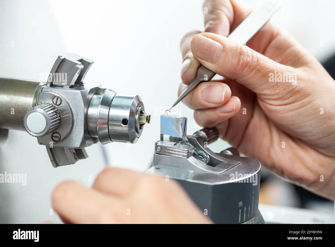 Closeup of a female scientist placing a sample on a transmission ...
