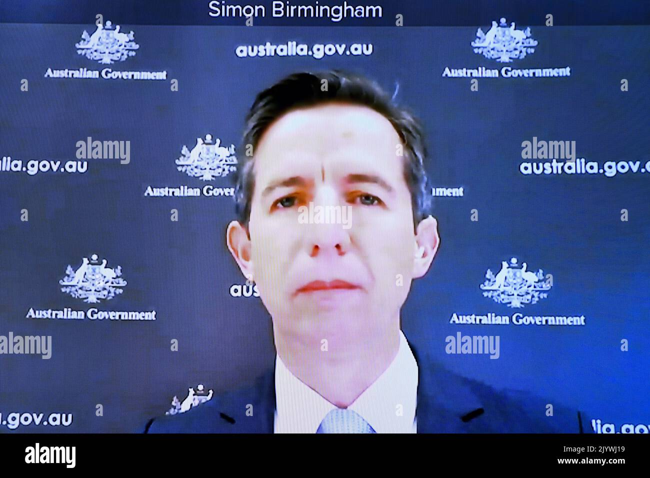 Minister for Finance Simon Birmingham appears via video link at a press ...