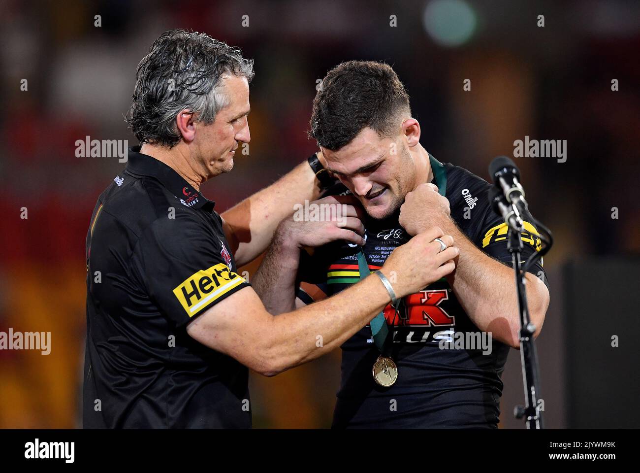 Panthers coach Ivan Cleary (left) presents the Clive Churchill Medal to ...