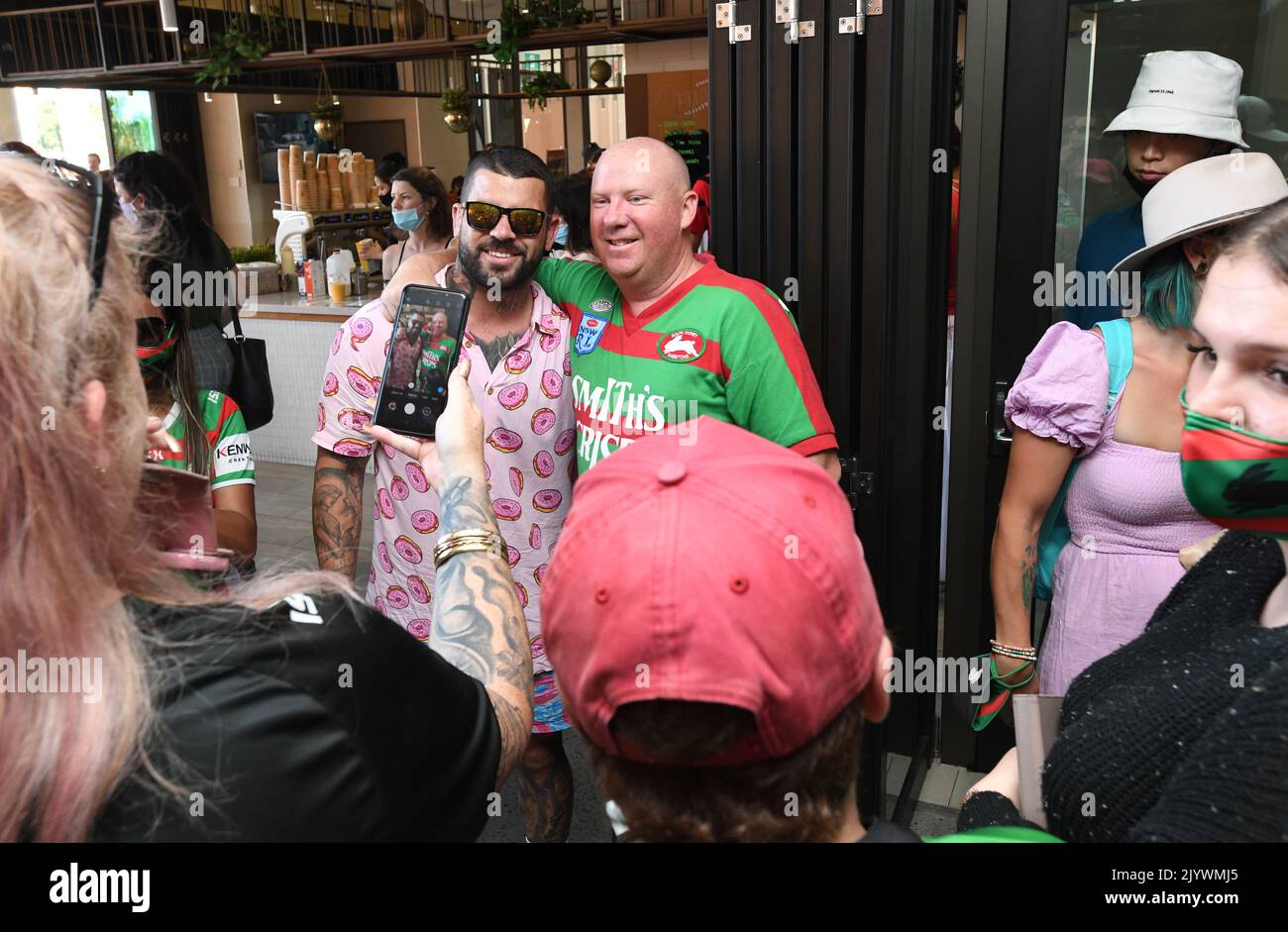 Adam Reynolds (centre) of the Rabbitohs is seen meeting fans during the ...