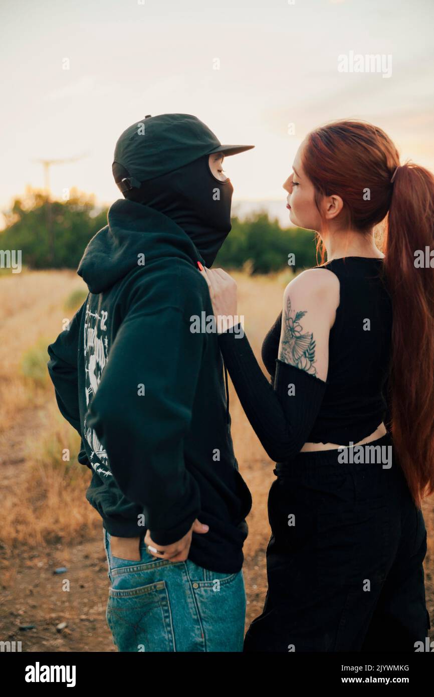 Young couple in love hugging during sunset Stock Photo - Alamy