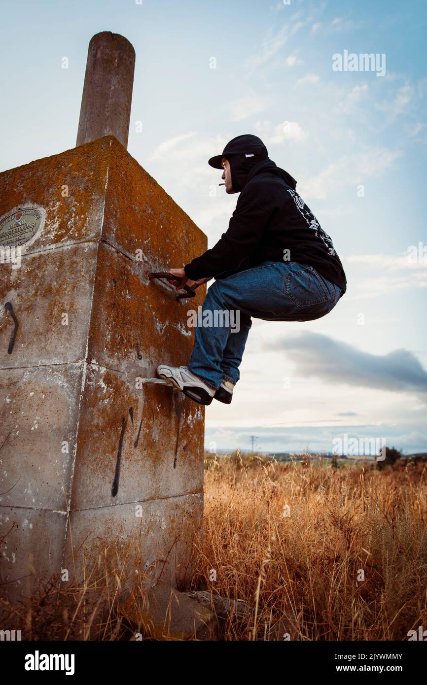 Guy with balaclava smoking a joint of marijuana Stock Photo - Alamy