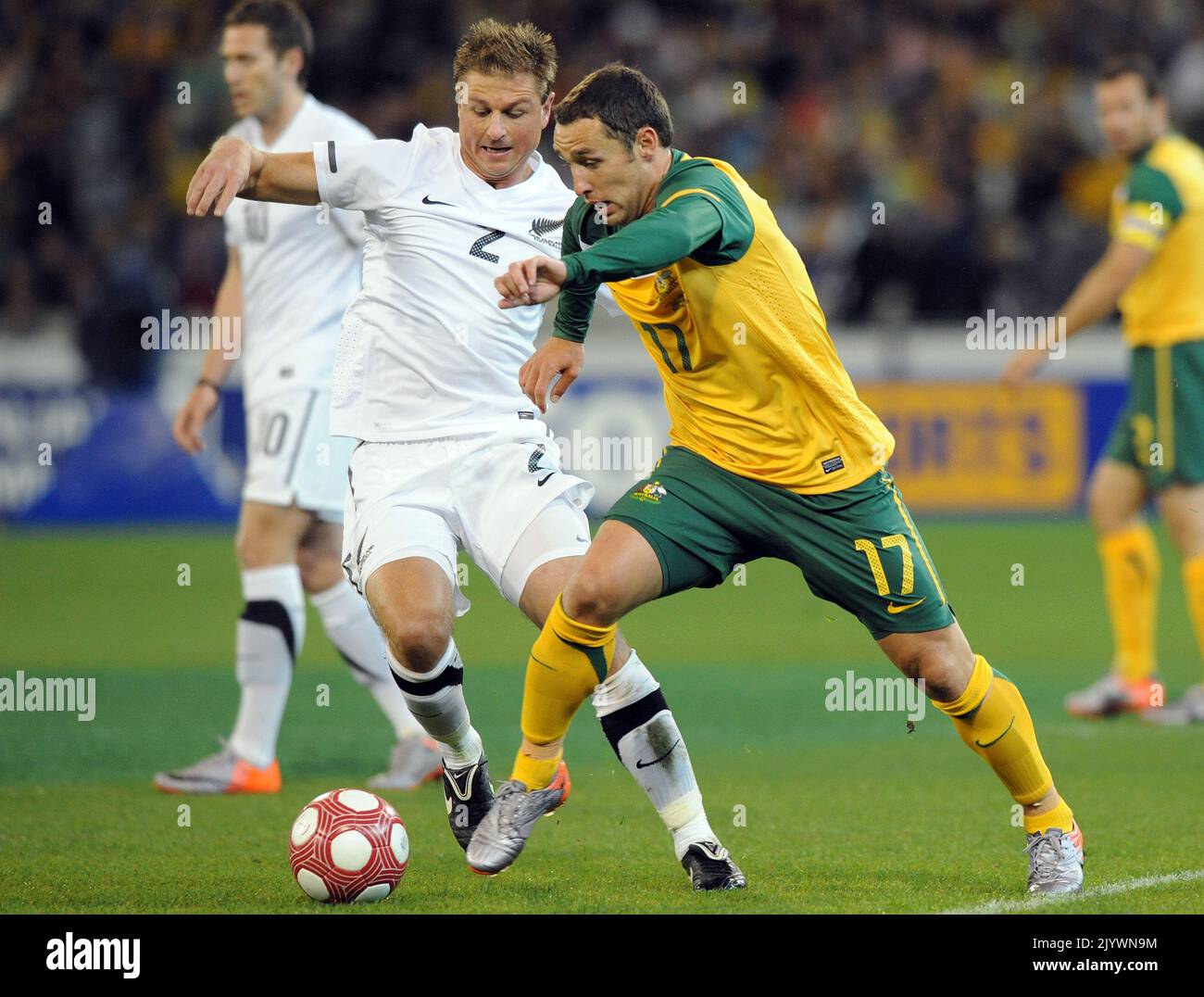 Australia's Scott McDonald gets past Ben Sigmund of New Zealand Stock ...