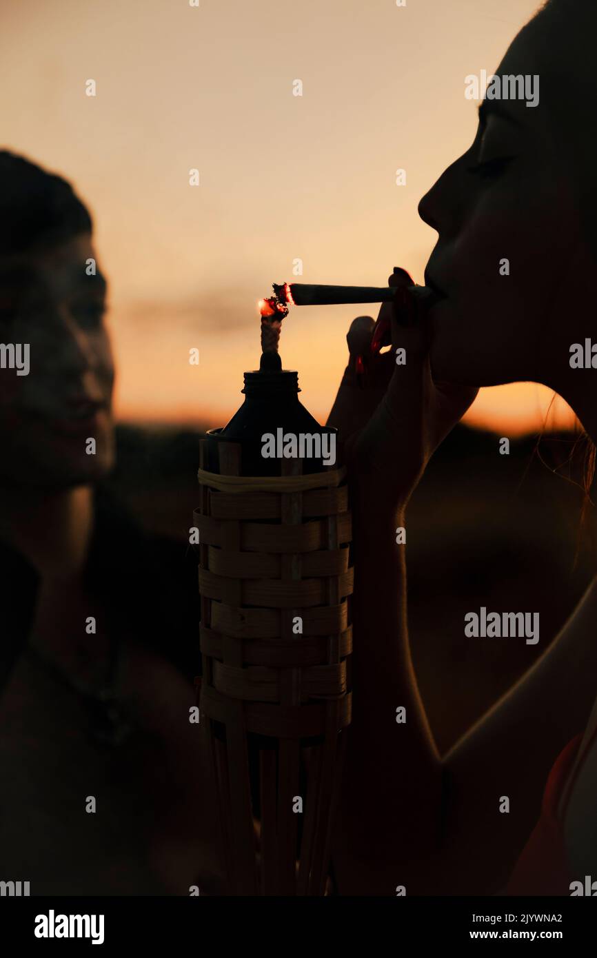 Young couple smoking cannabis in hi-res stock photography and images ...