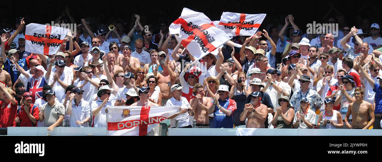 The Barmy Army supporters celebrate England's batsman Alistair Cook ...