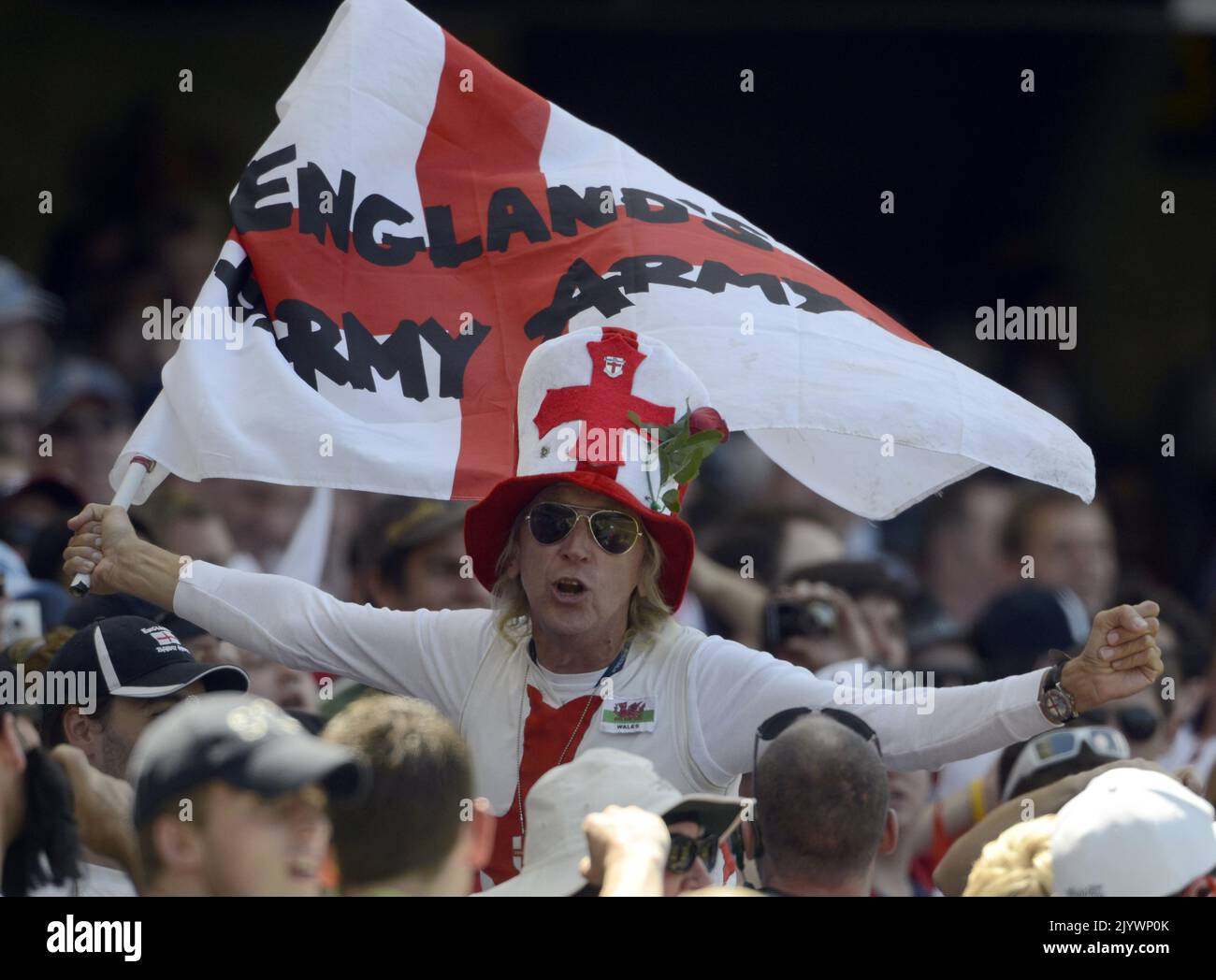 The Barmy Army supporters celebrate England's batsman Alistair Cook ...