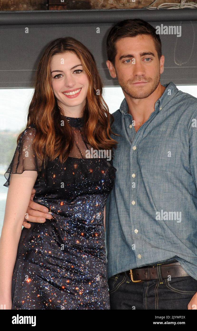 Jake Gyllenhaal and Anne Hathaway pose for photographs at a press ...