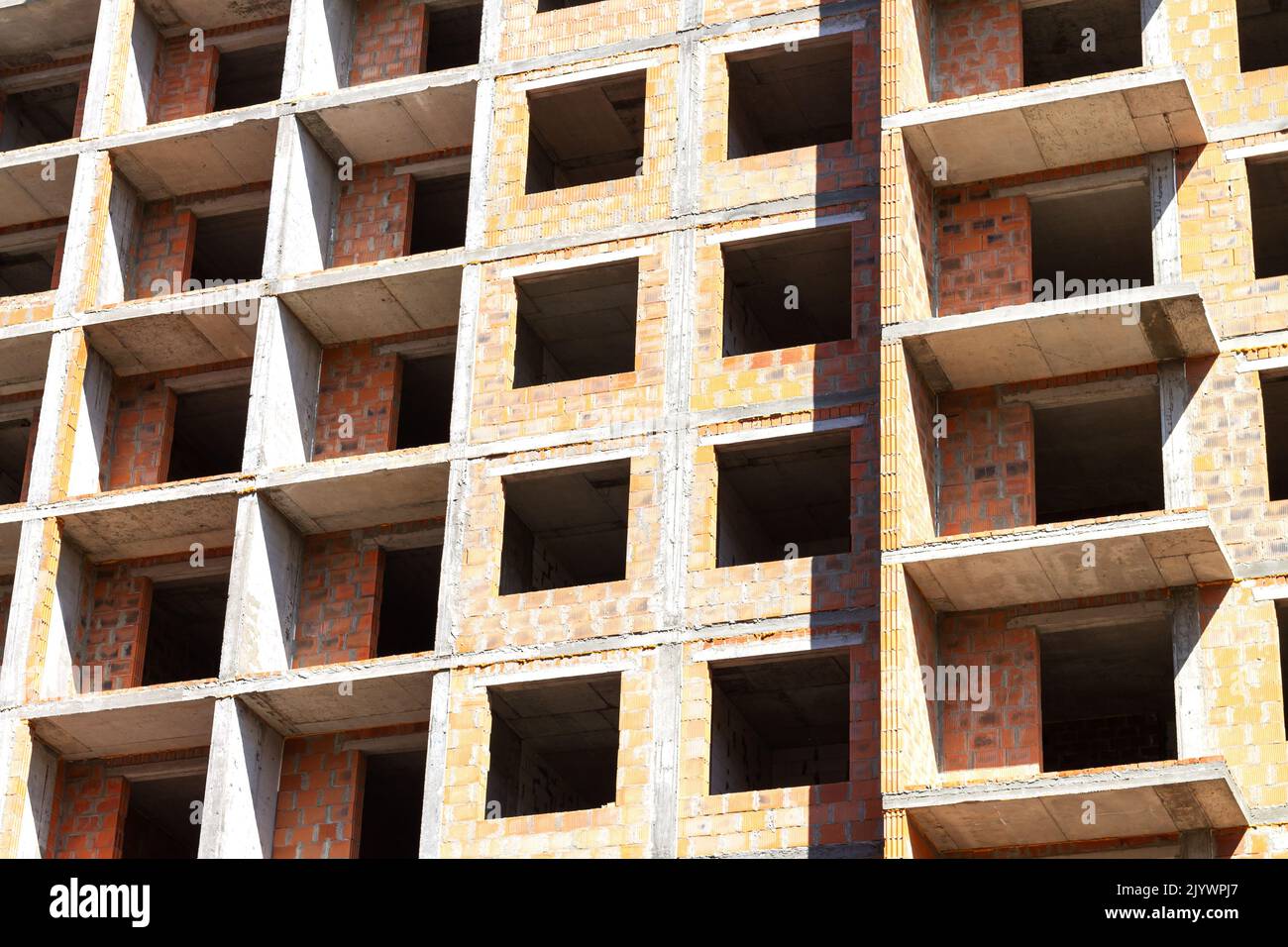 Construction site with unfinished high-rise building Stock Photo - Alamy
