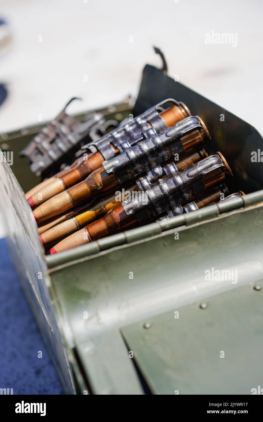 Close up shot of a machine gun belt loaded with cartridges, in an ammo ...