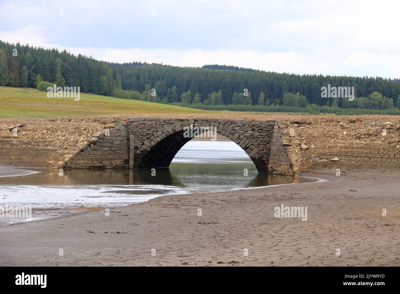 dried up empty reservoir and dam during a summer heatwave, low rainfall ...