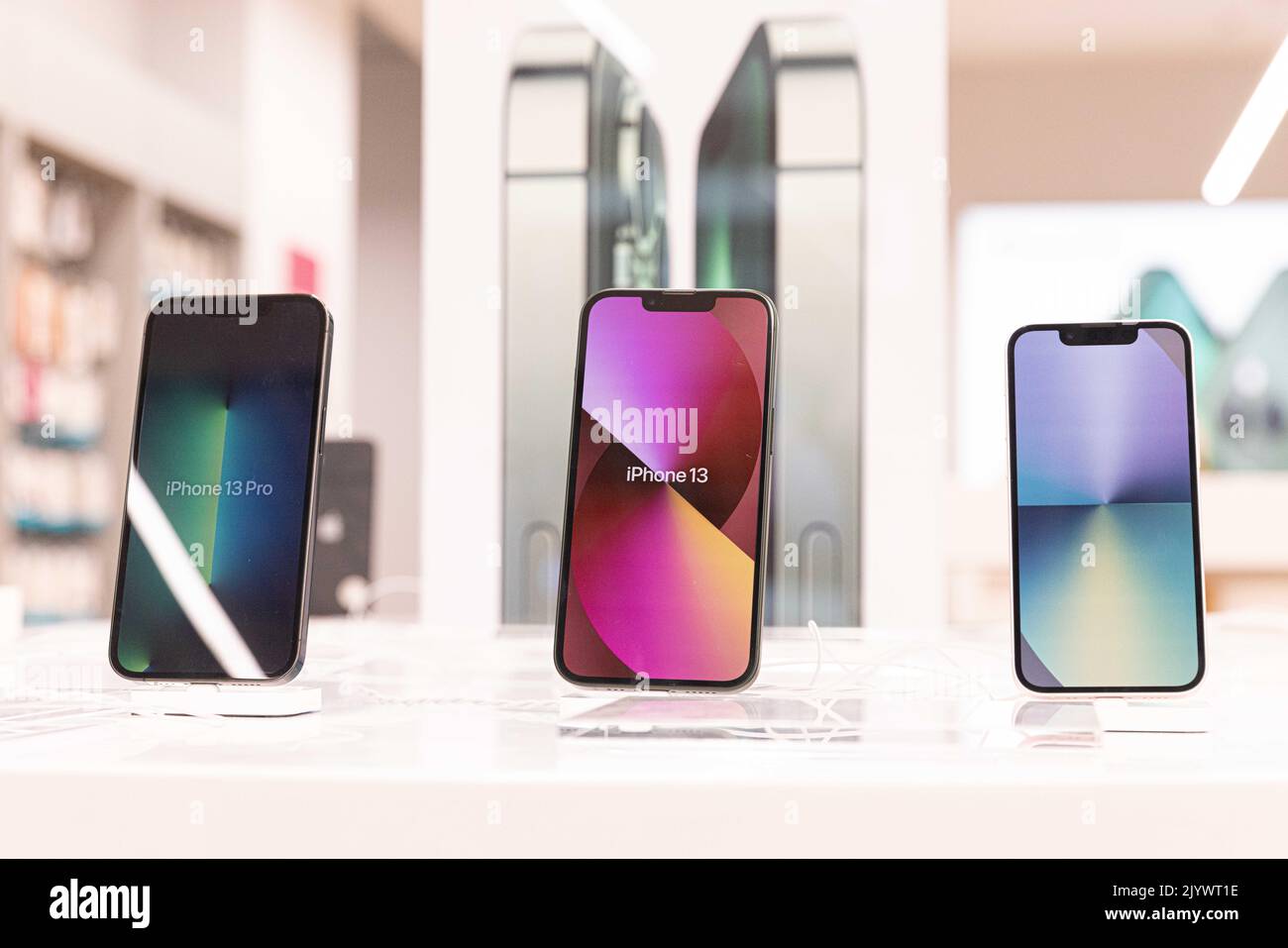 Apple’s iPhone 13 lineup on display inside an electronics store in ...