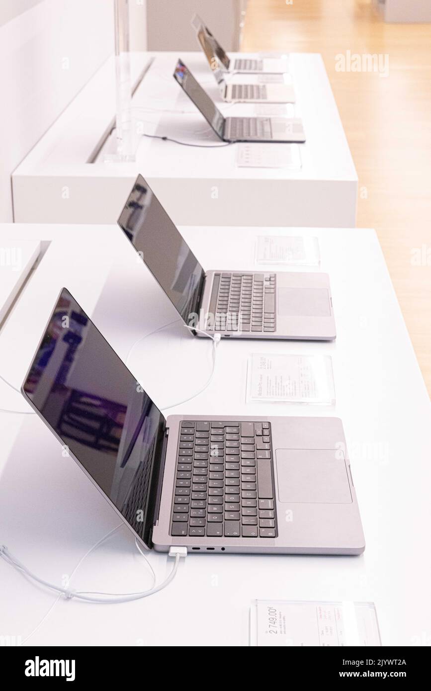 Apple laptops seen on display inside an electronics store in Bratislava ...