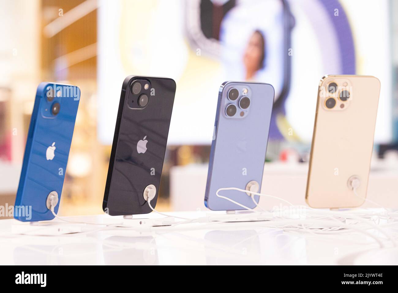 Apple’s iPhone 13 lineup on display inside an electronics store in ...