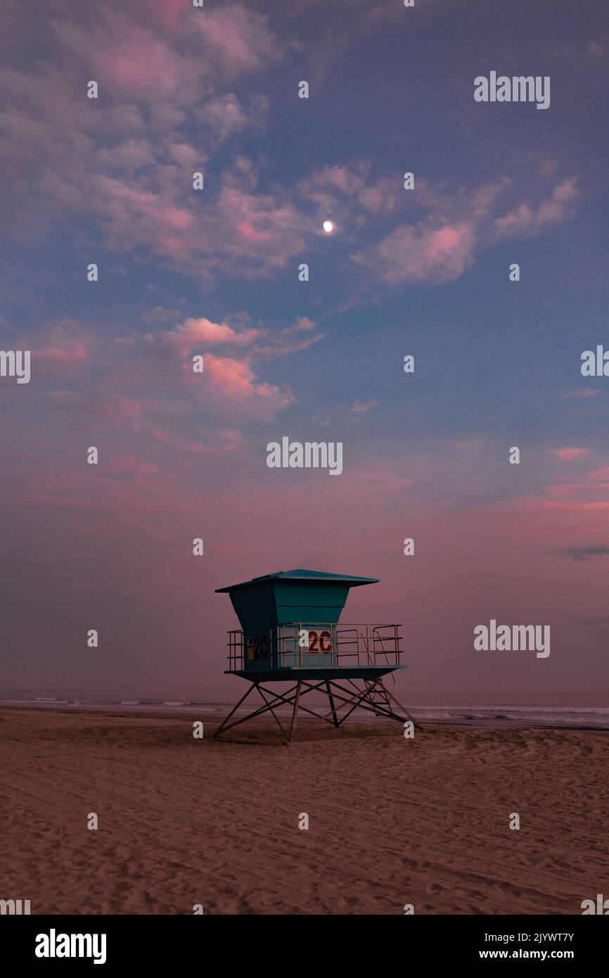 Dusk photos at the beach with pink and blue skies and lifeguard tower ...