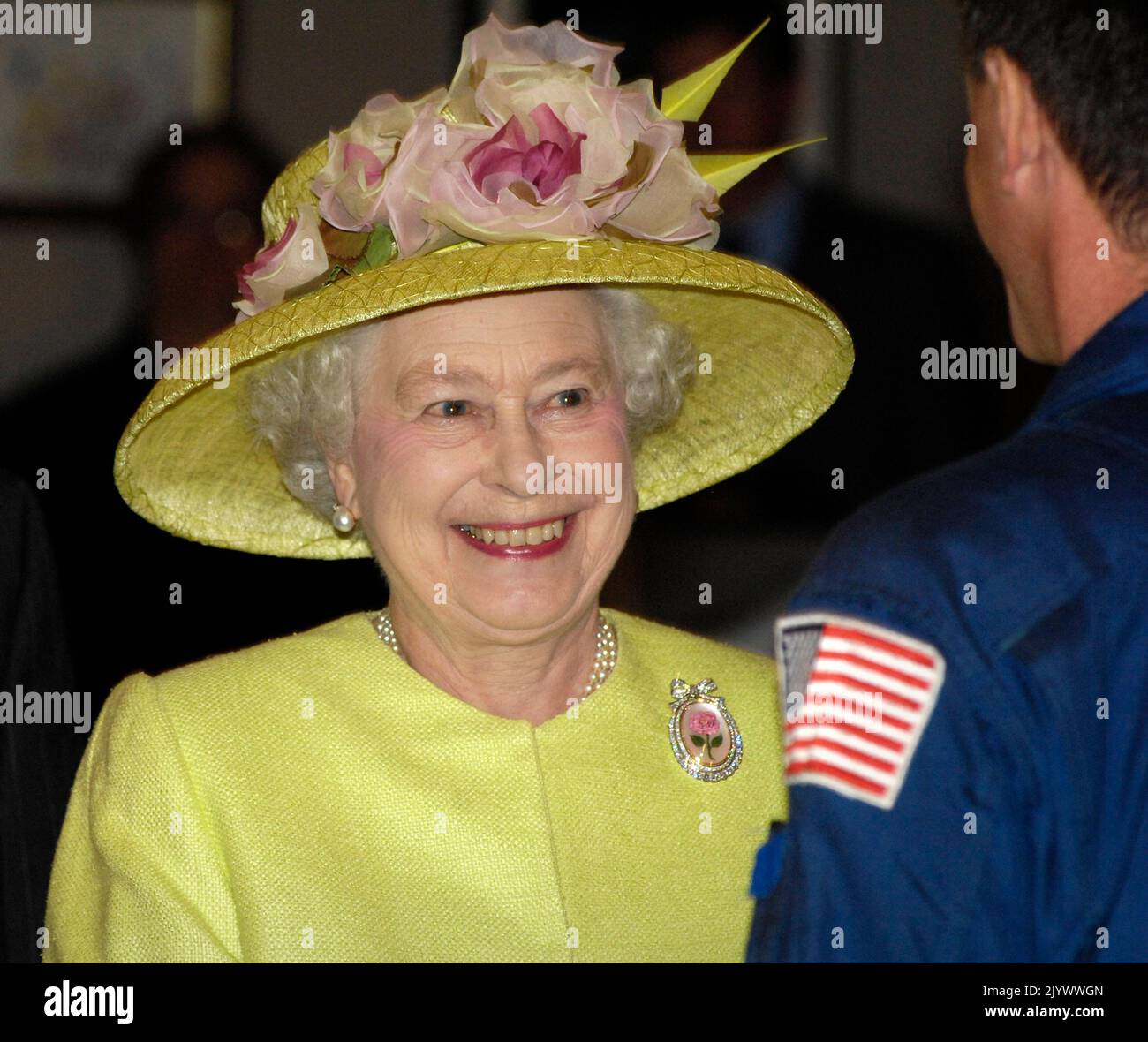 Queen Elizabeth, left, prepares to talk with the International Space ...