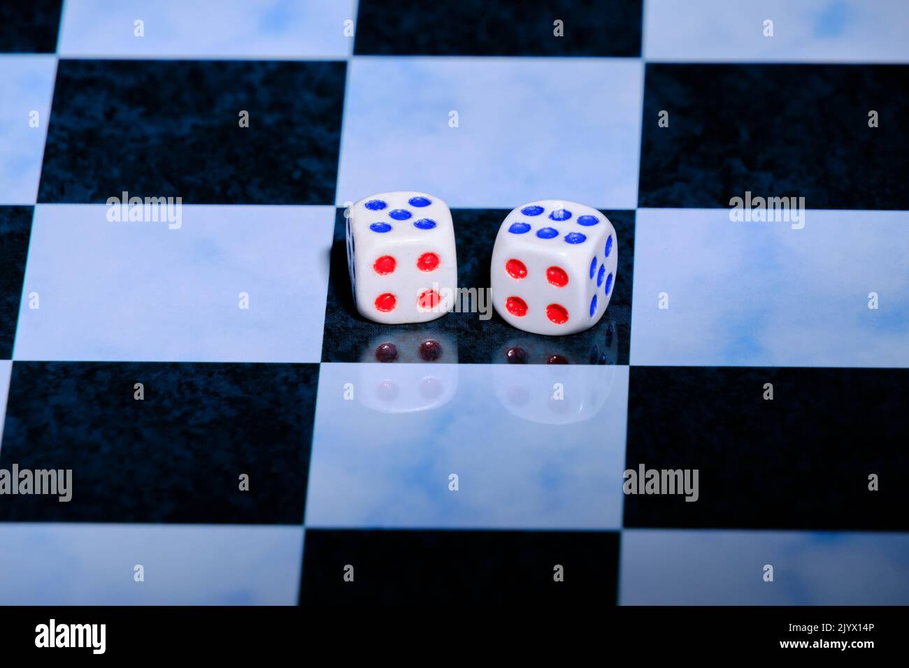 Playing dice with numbers six and five chess board Stock Photo - Alamy