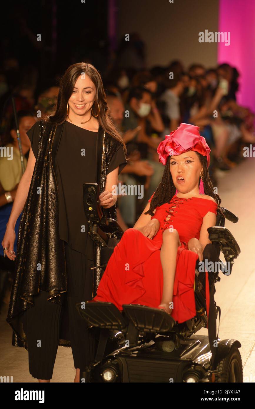 A model is seen on the runway during the Double Take Runway Show in New ...