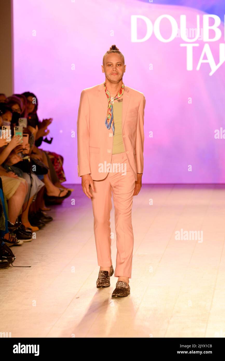 A model is seen on the runway during the Double Take Runway Show in New ...