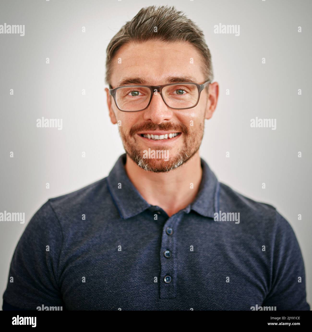 Hes a friendly guy. Cropped portrait of a mature man standing against a ...