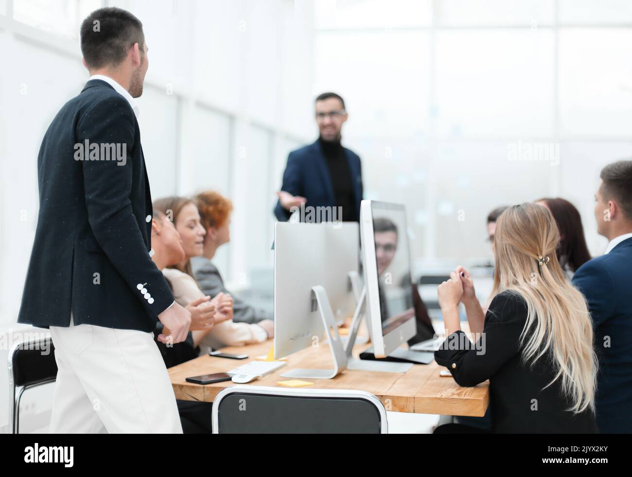 employee asks a question during a group meeting Stock Photo - Alamy