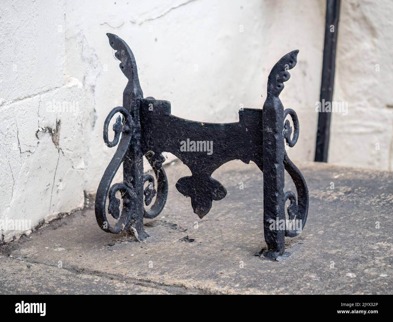 Boot scraper outside door Stock Photo - Alamy