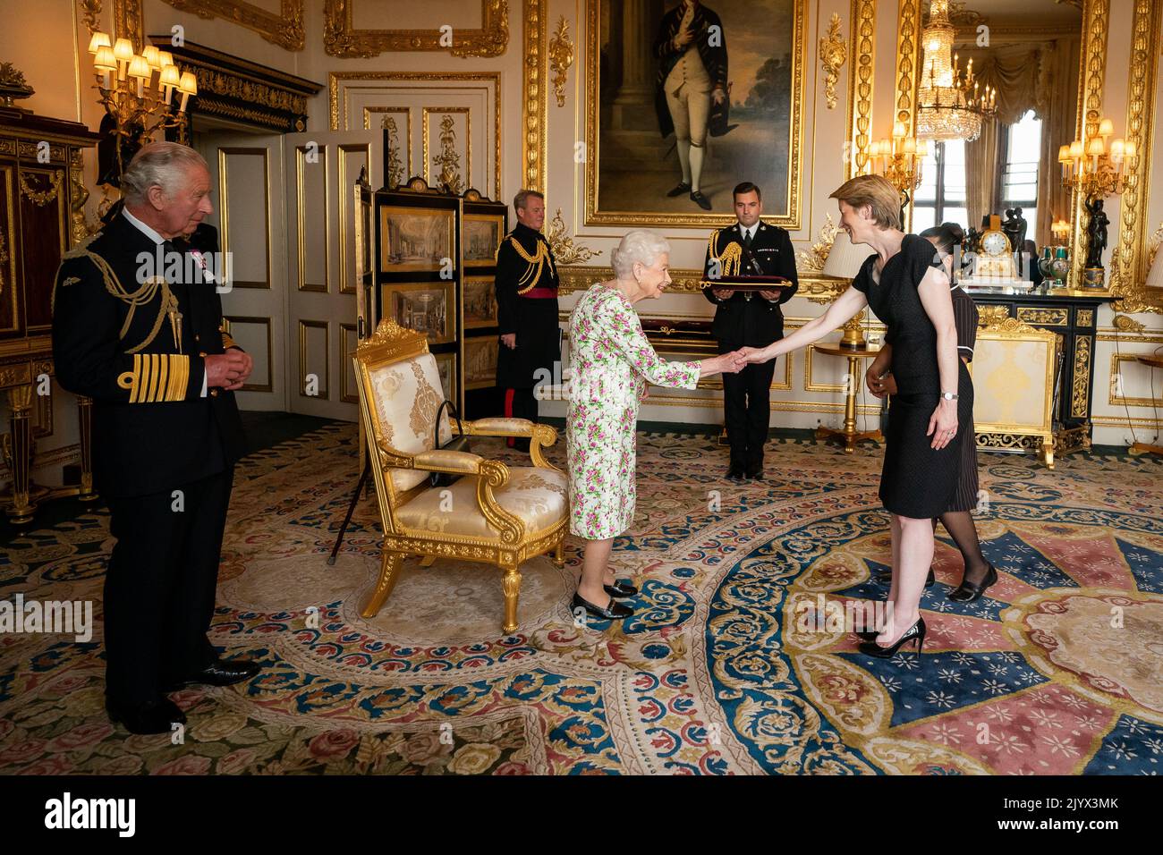 File photo dated 12/07/2022 of Queen Elizabeth II, accompanied by the ...