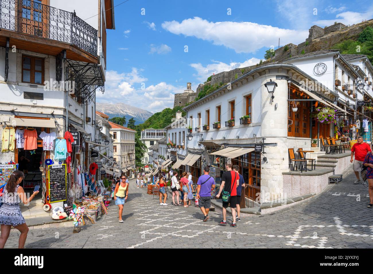Cobbled street in the historic town centre looking towards Gjirokastra ...
