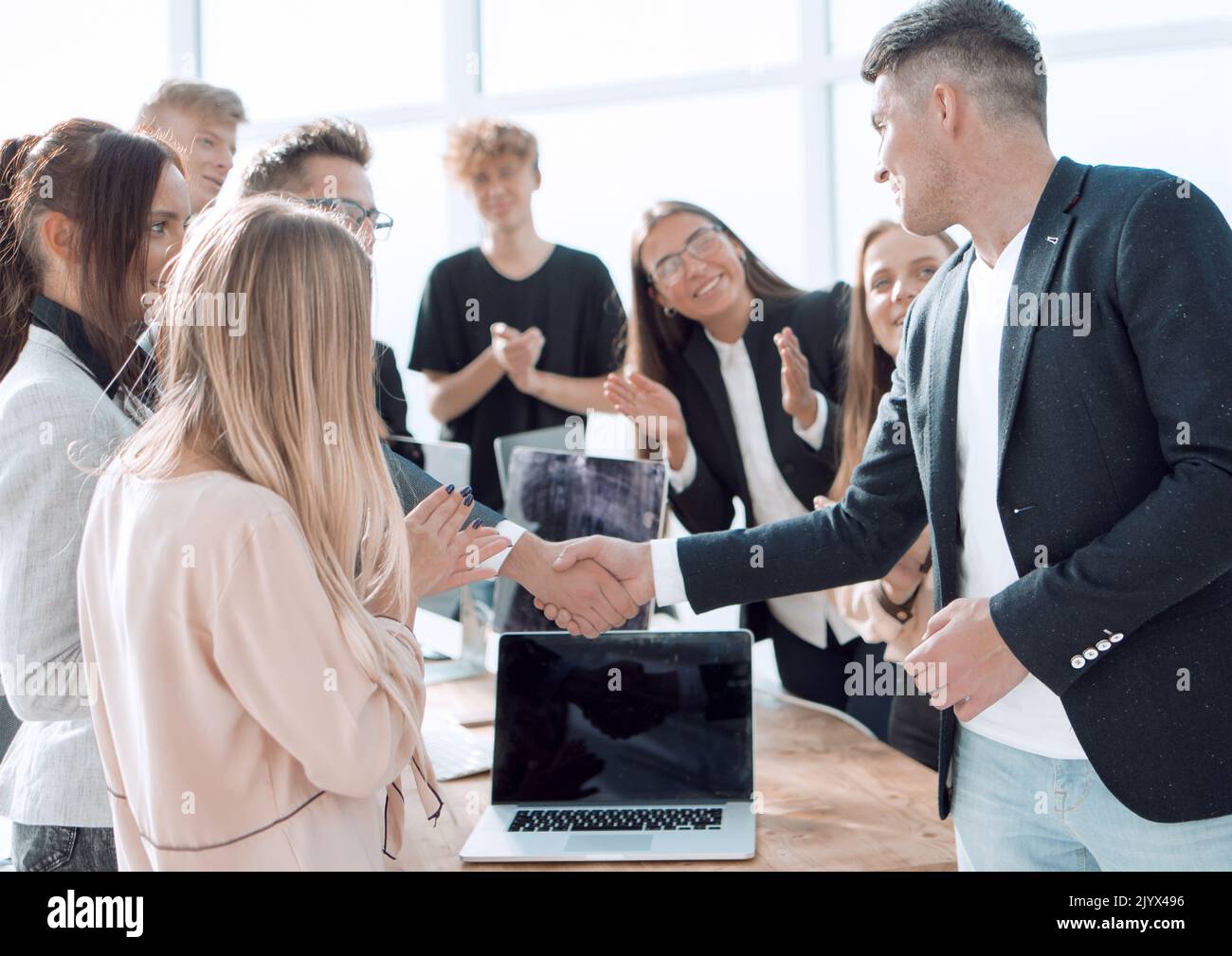 happy employees congratulating each other on their success Stock Photo ...