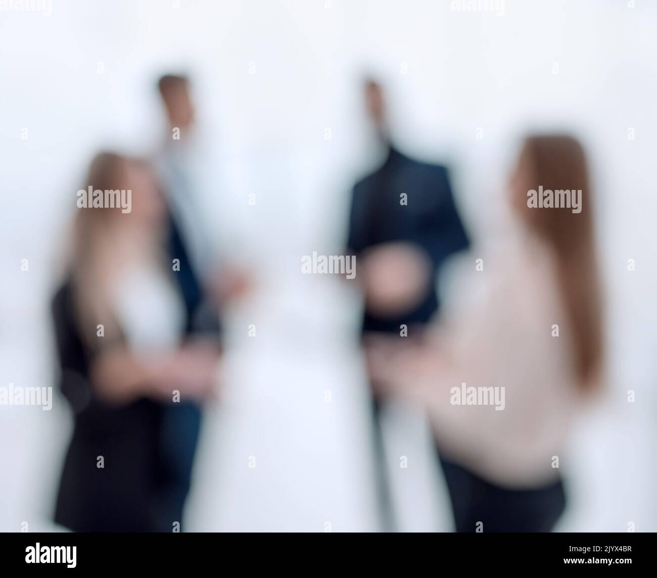 blurry image of employees standing in the office Stock Photo - Alamy