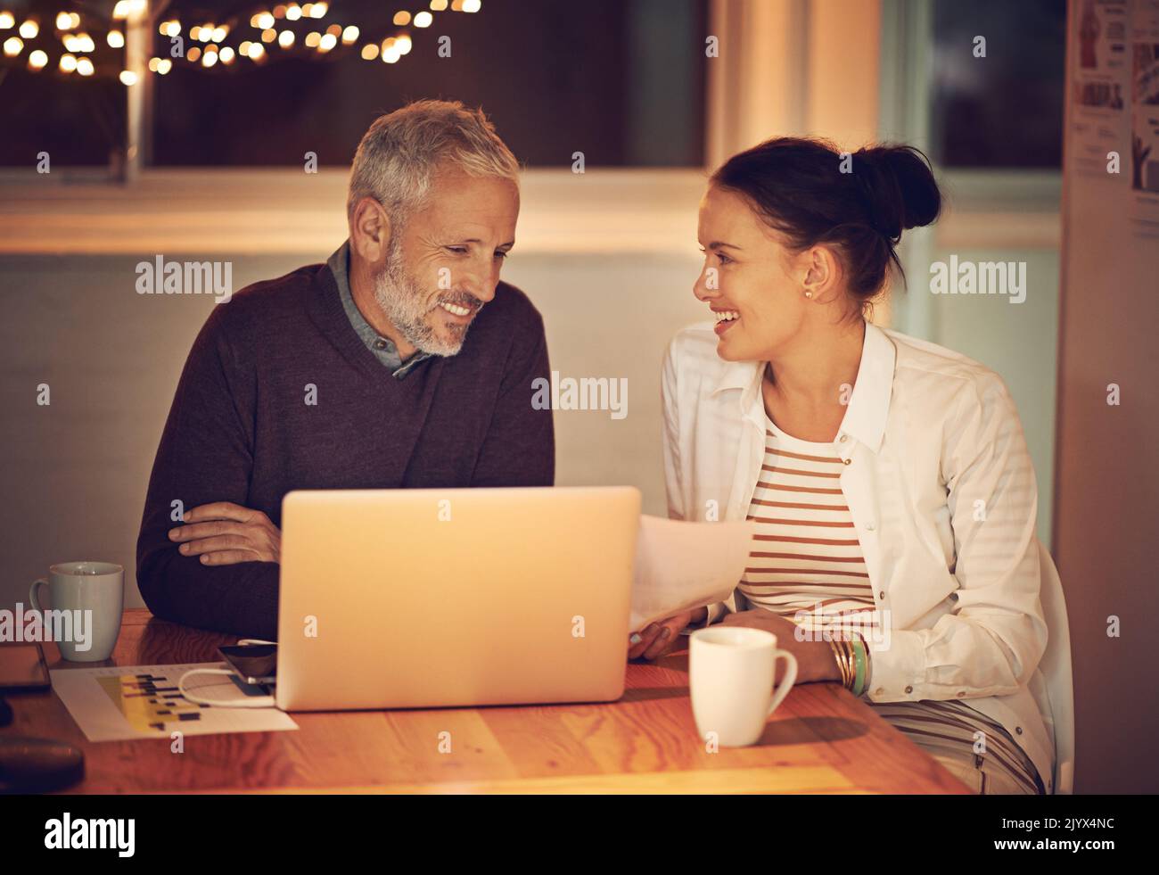 Were making good progress. two colleagues working late at the office ...