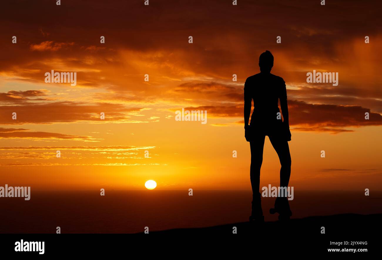 Sunset, silhouette and woman admiring the horizon view and watching the ...