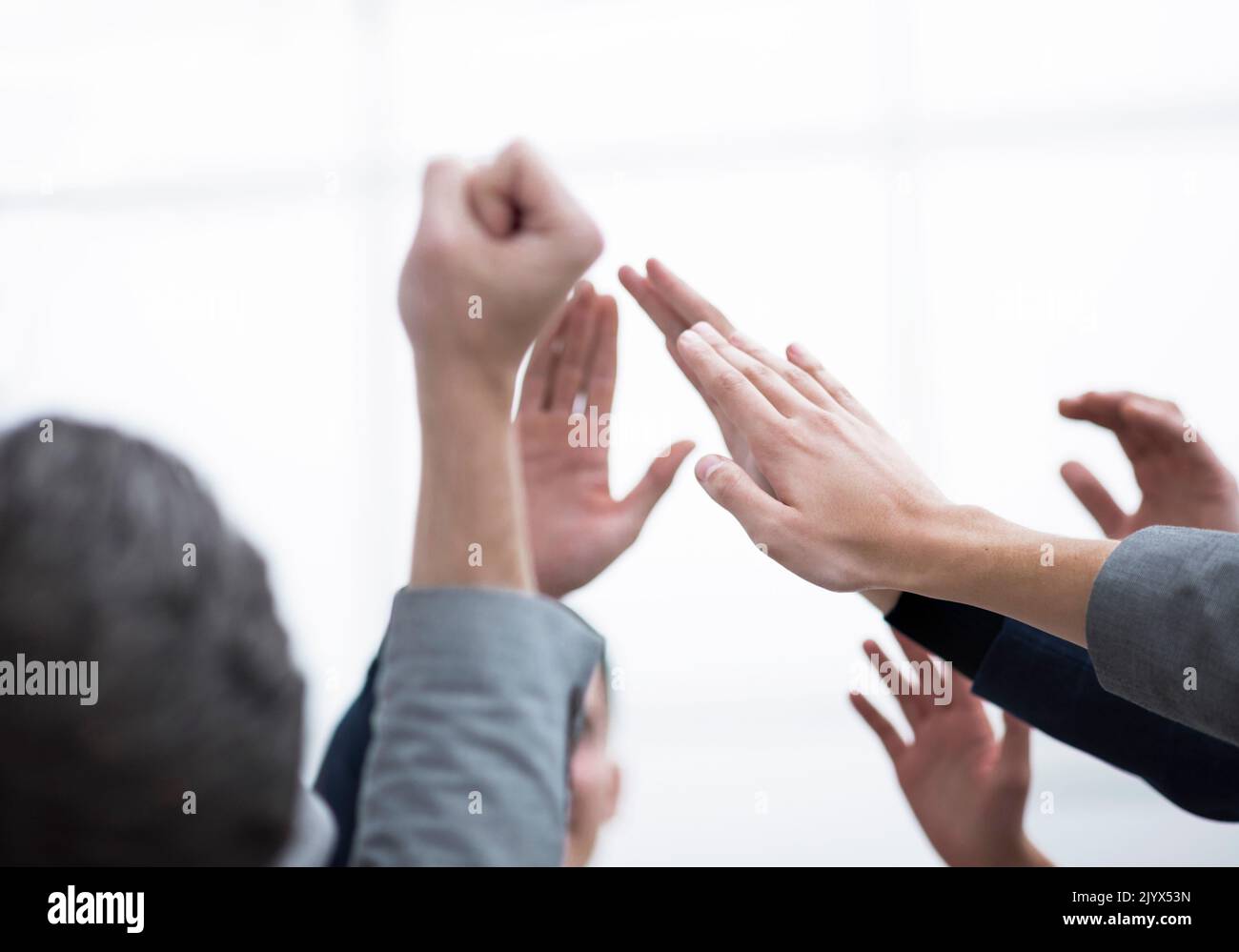 group of happy employees giving each other a high five Stock Photo - Alamy