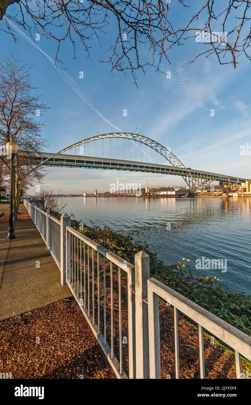 View of the Fremont Bridge from along the railing near the shoreline ...