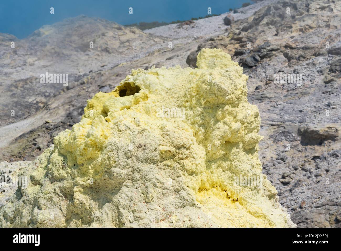cone of sulfur deposits around a fumarole in a solfataric field ...