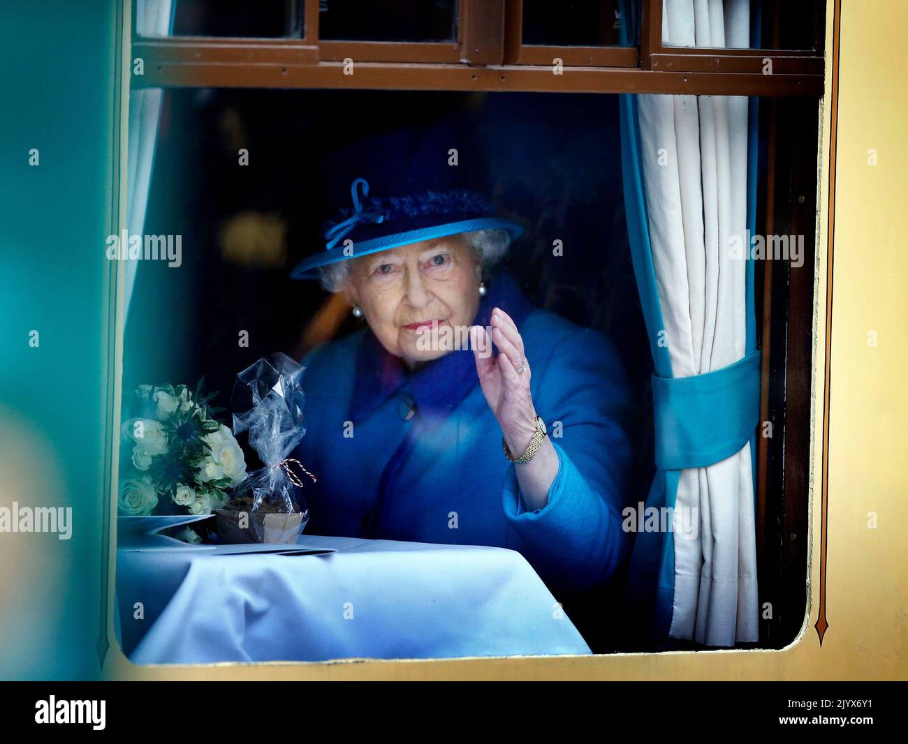 File photo dated 09/09/2015 of Queen Elizabeth II waving from a ...