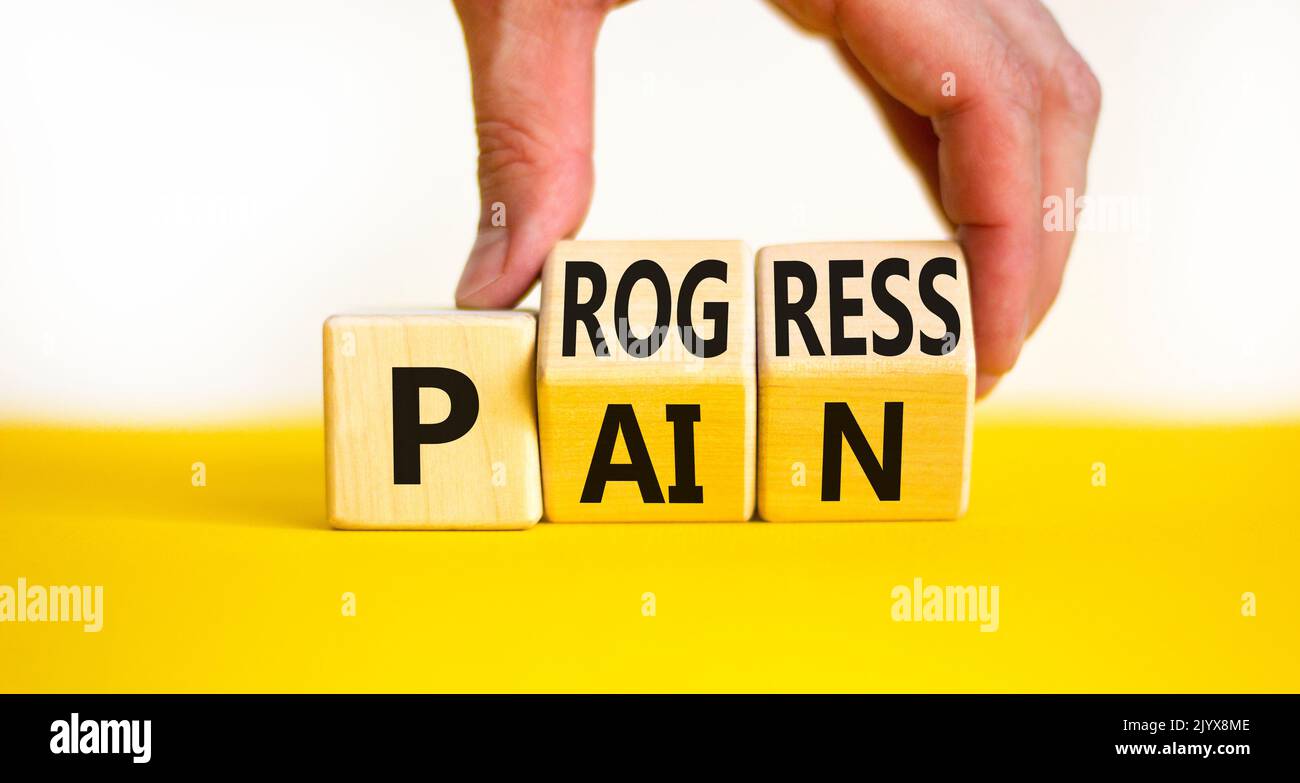 Pain or progress symbol. Concept words Pain or Progress on wooden cubes ...