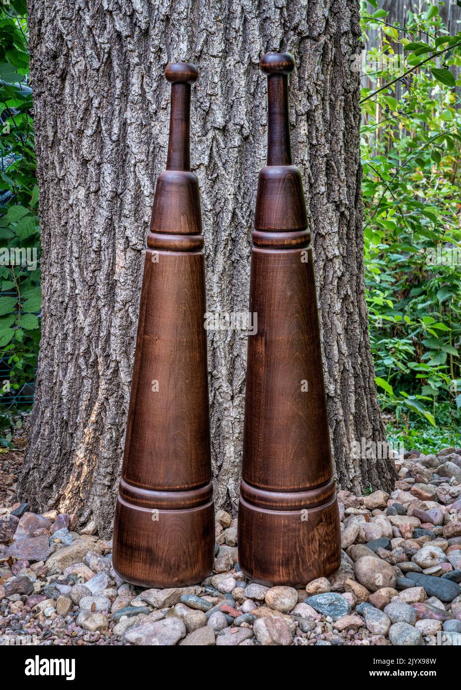 A couple of traditional wooden Persian meels in a backyard. They ...