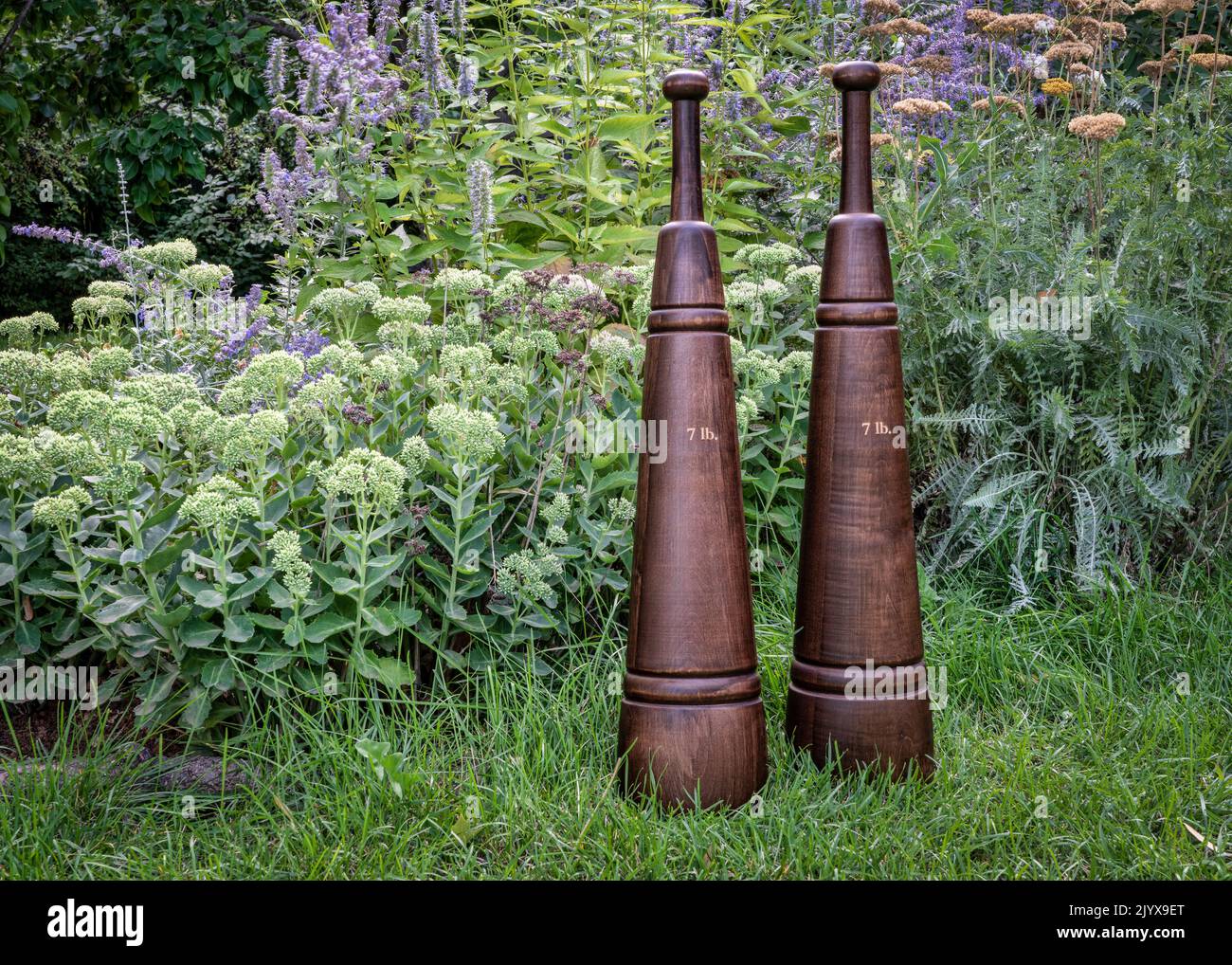A couple of traditional wooden Persian meels in a backyard. They ...