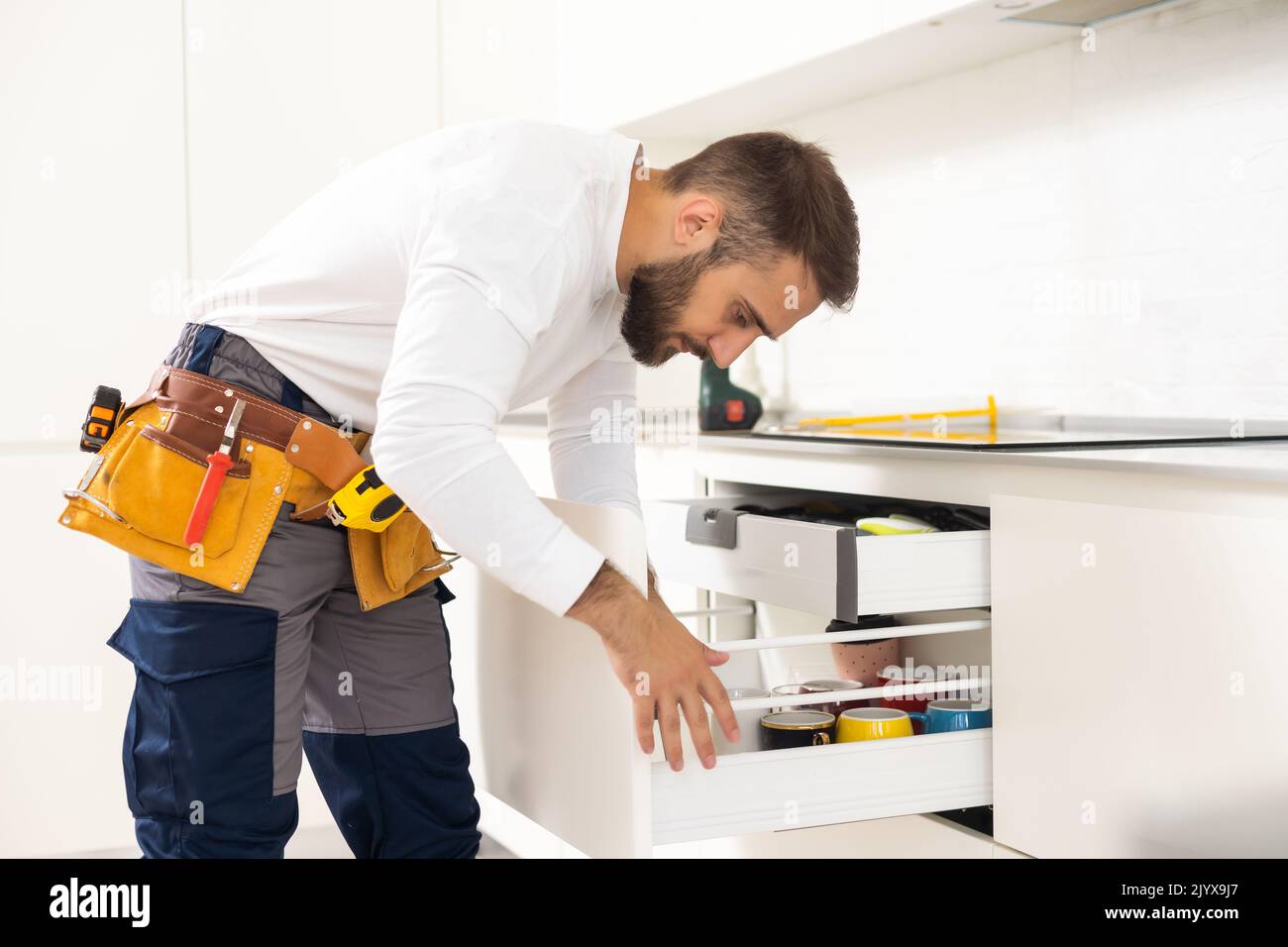 Two men fixing in kitchen hi-res stock photography and images - Alamy