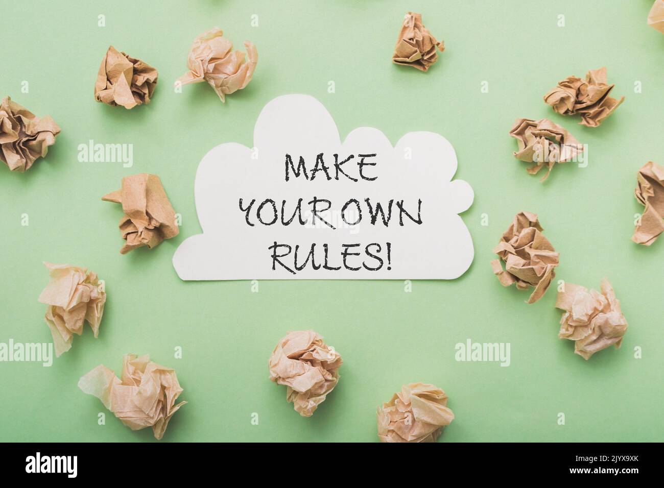 Phrase Make your Own Rules and paper balls on light green Stock Photo ...