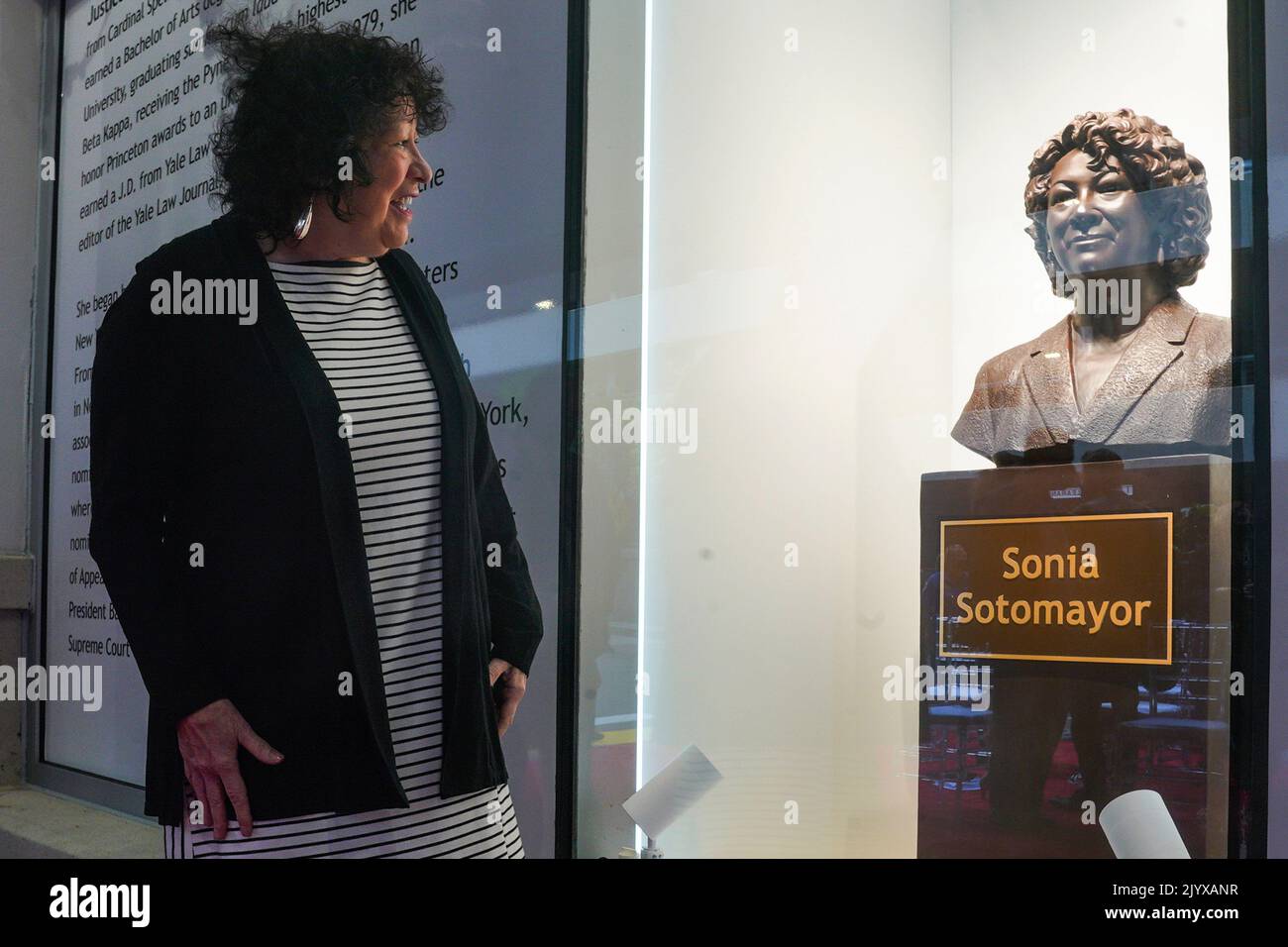 Supreme Court Associate Justice Sonia Sotomayor looks at a bronze bust ...