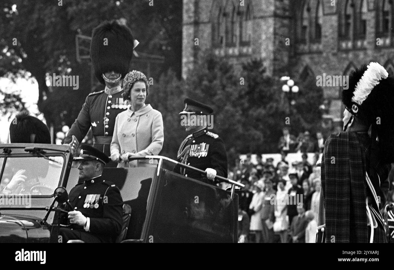 Queen Elizabeth and Lt.-Col. C.V. Carlson, parade commander, (left ...