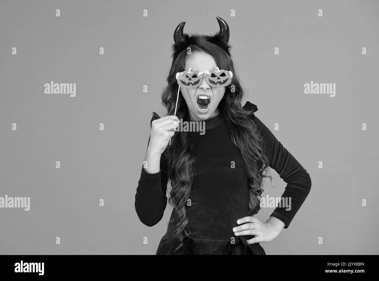 shouting emotionally child in imp horn costume to halloween with funny ...