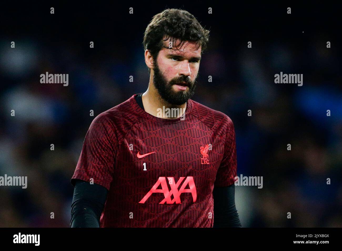 Liverpool's Brazilian goalkeeper Alisson Becker controls the ball ...