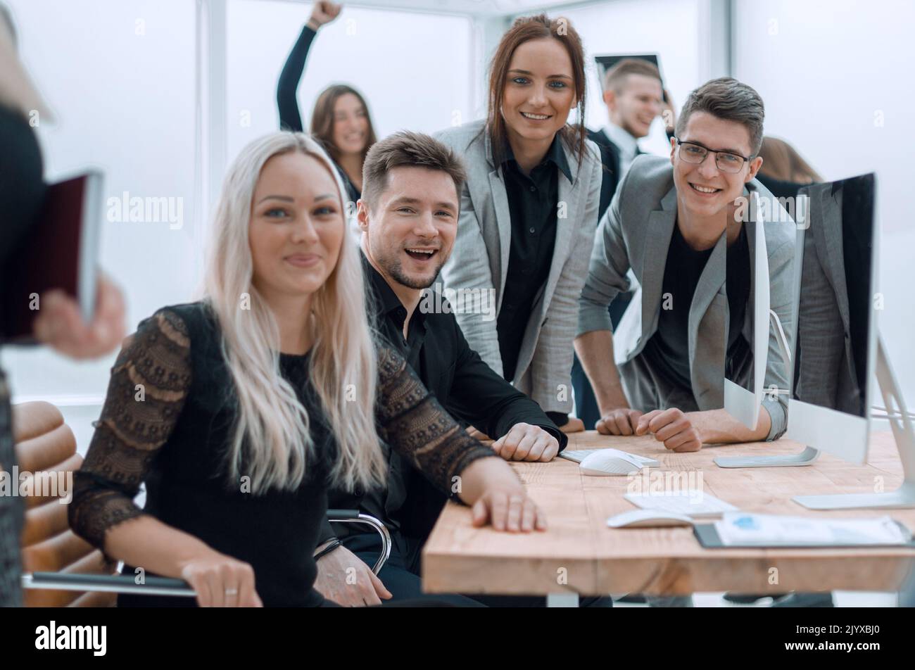 fun group of young employees in the workplace Stock Photo - Alamy
